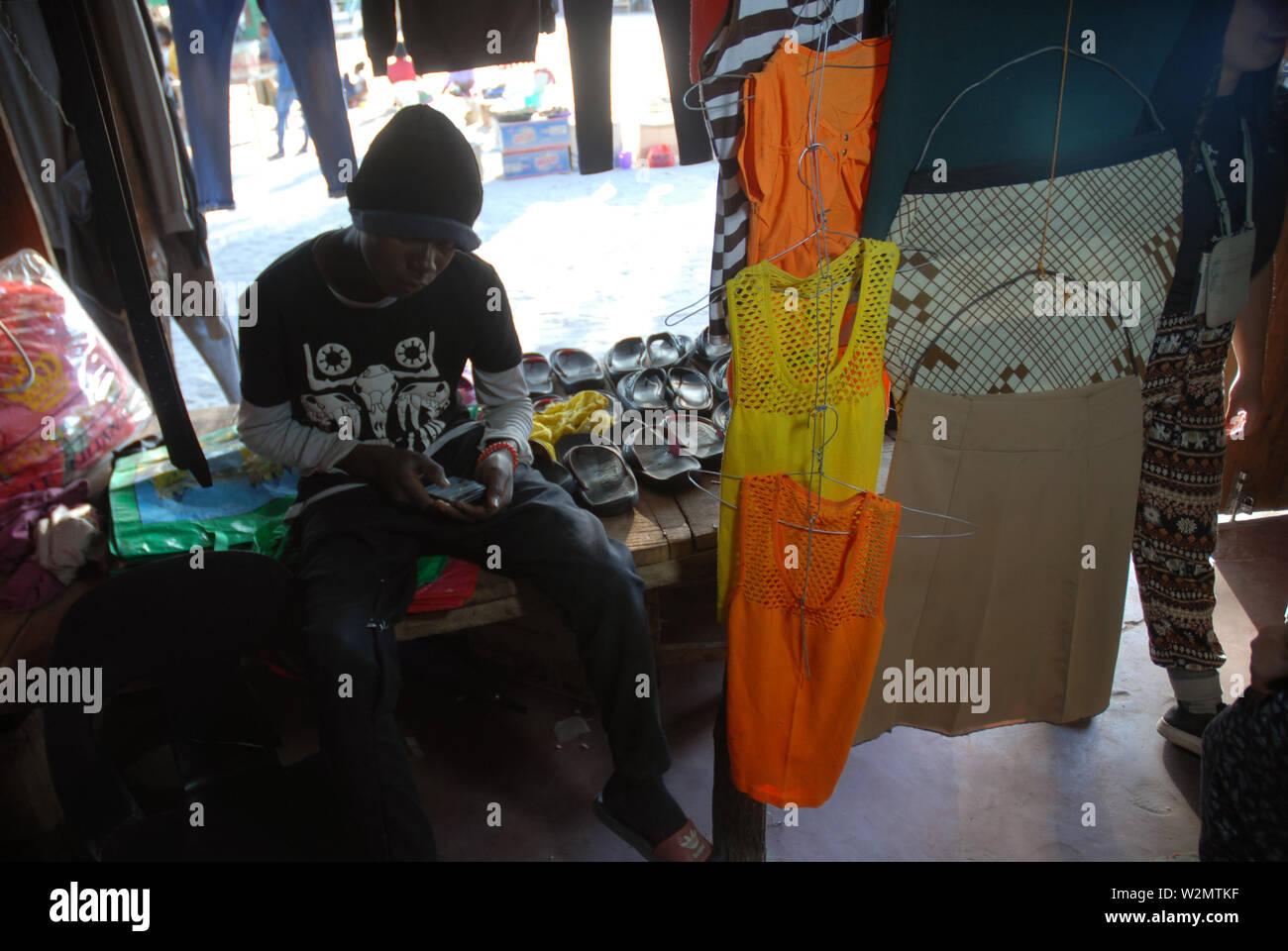 Man selling clothes in market, Mwandi, Zambia, Africa Stock Photo - Alamy
