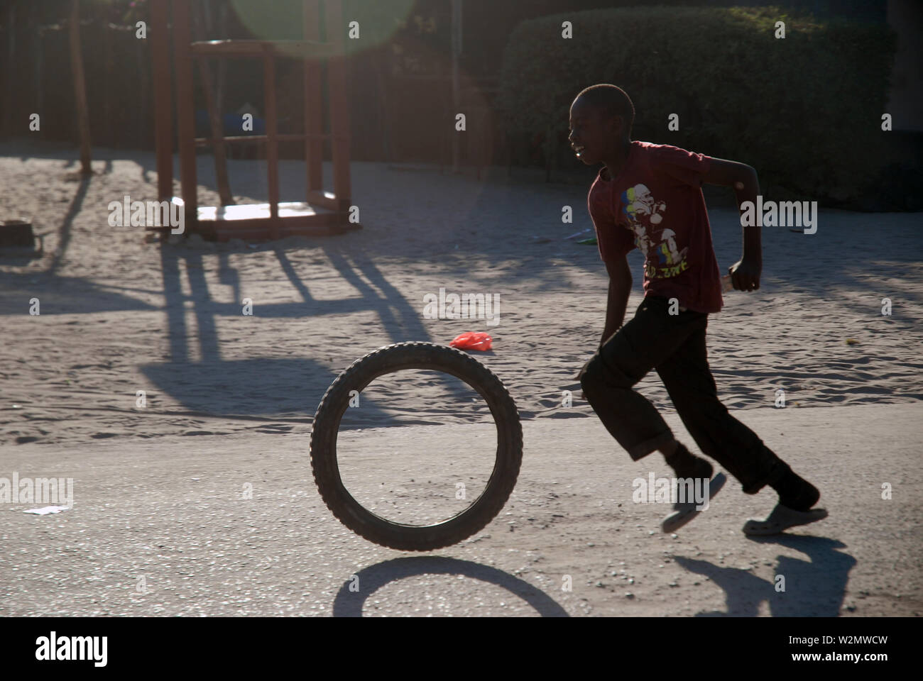 Boy Rolling Tyre High Resolution Stock Photography and Images - Alamy