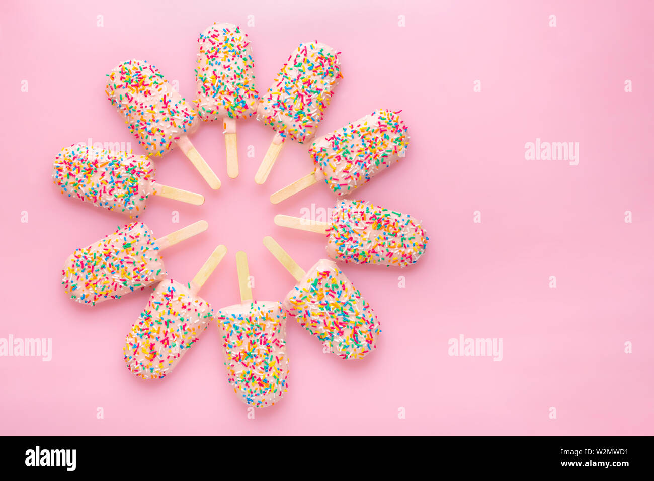 flat lay of creative concept of popsicles in form of circle with ...