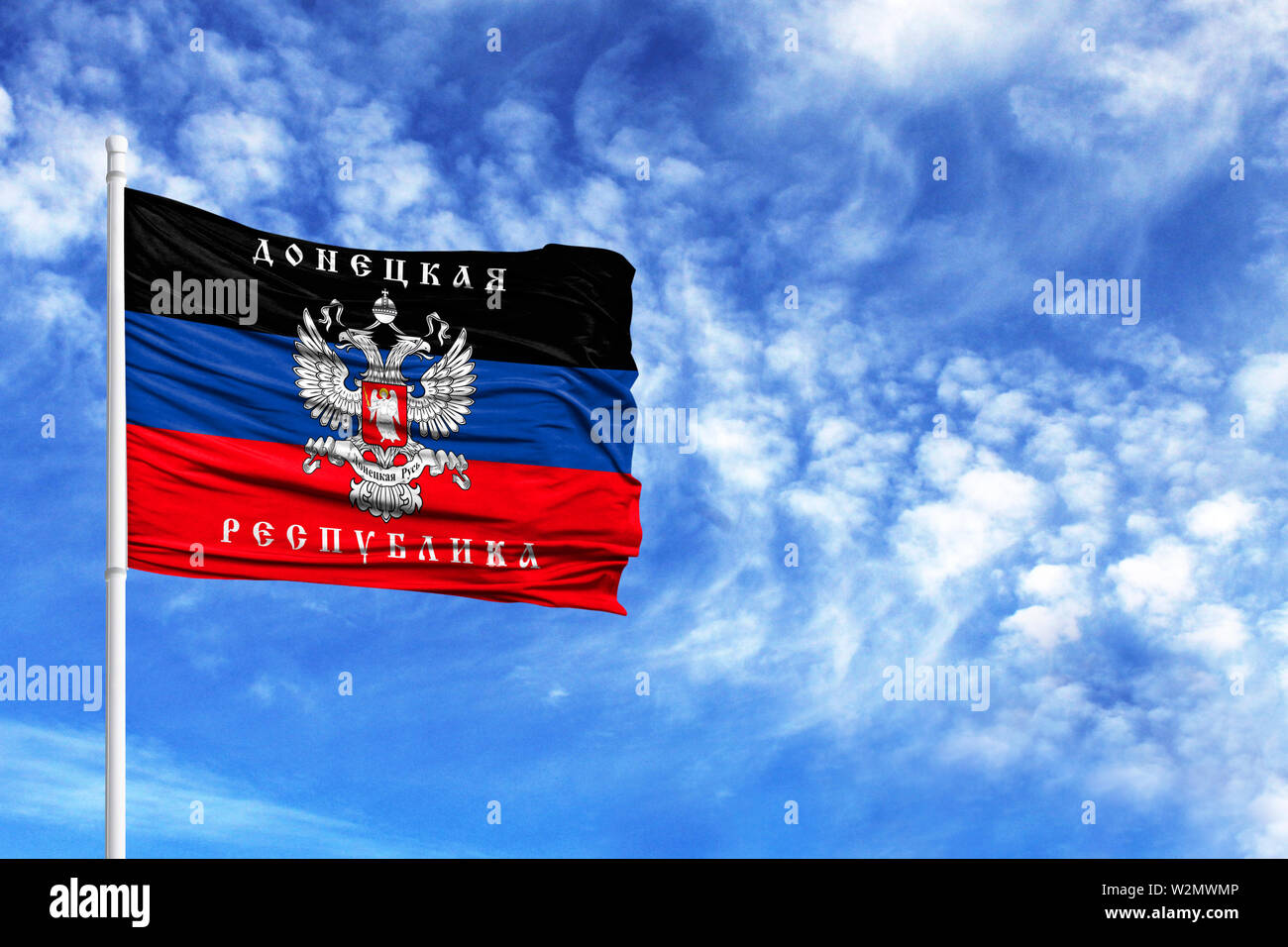 National flag of the Donetsk People's Republic on a flagpole in front ...