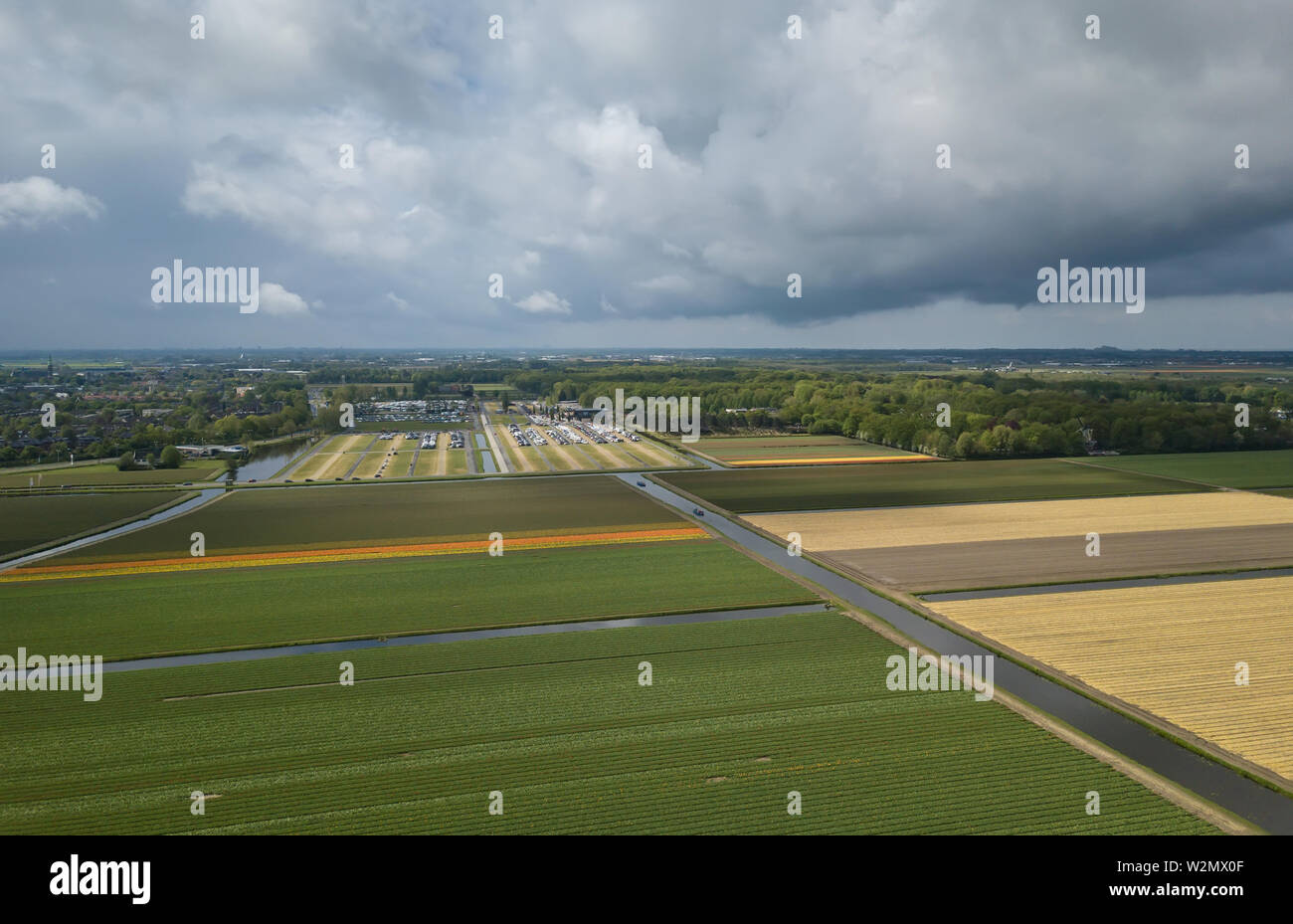 Aerial drone shot of agricultural fields with crops growing in rural ...