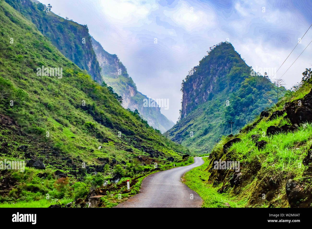 Road through dramatic limestone scenery in the Dong Van Geopark ...