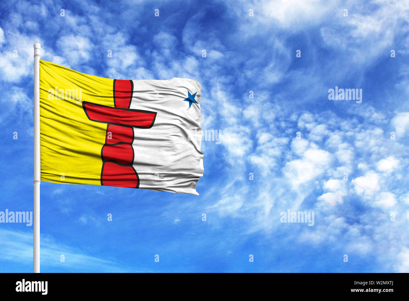 National flag of Nunavut on a flagpole in front of blue sky Stock Photo ...
