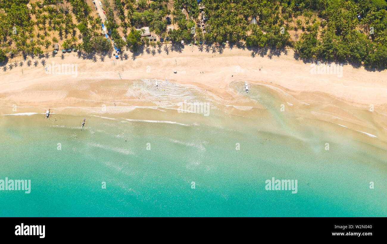 Aerial drone of beautiful tropical beach in cove with blue lagoon and ...