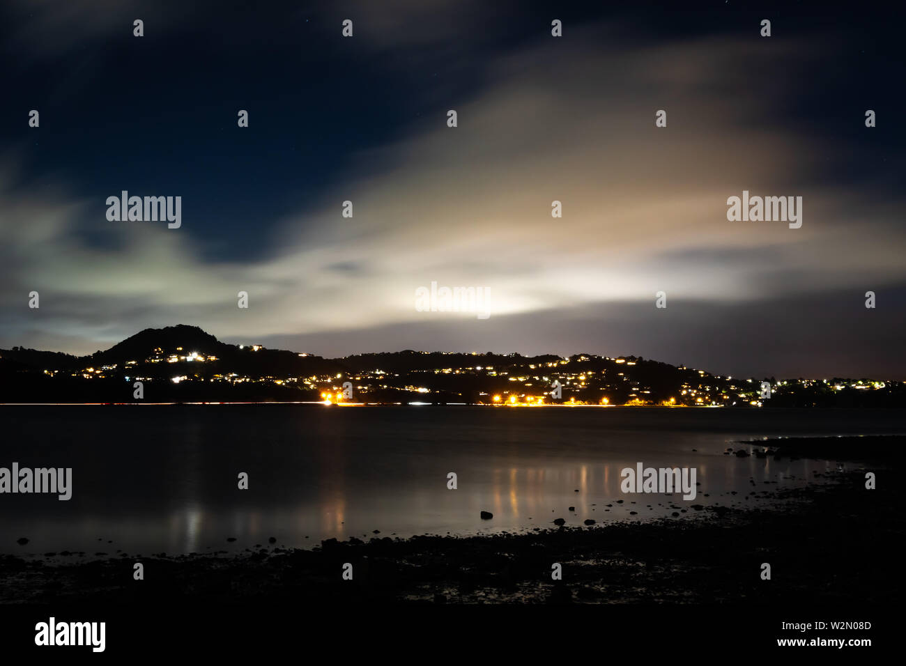 City lights reflected in harbour, Whitby, Pauatahanui Inlet, Wellington ...