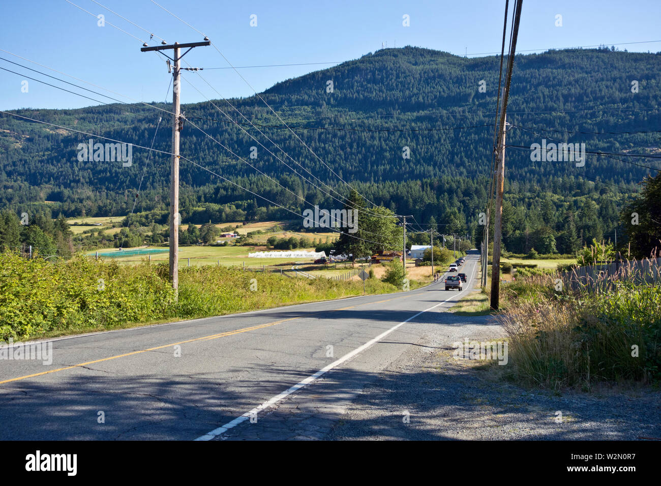 Salt Spring Island, BC Canada- highway with cars and cyclists traveling ...
