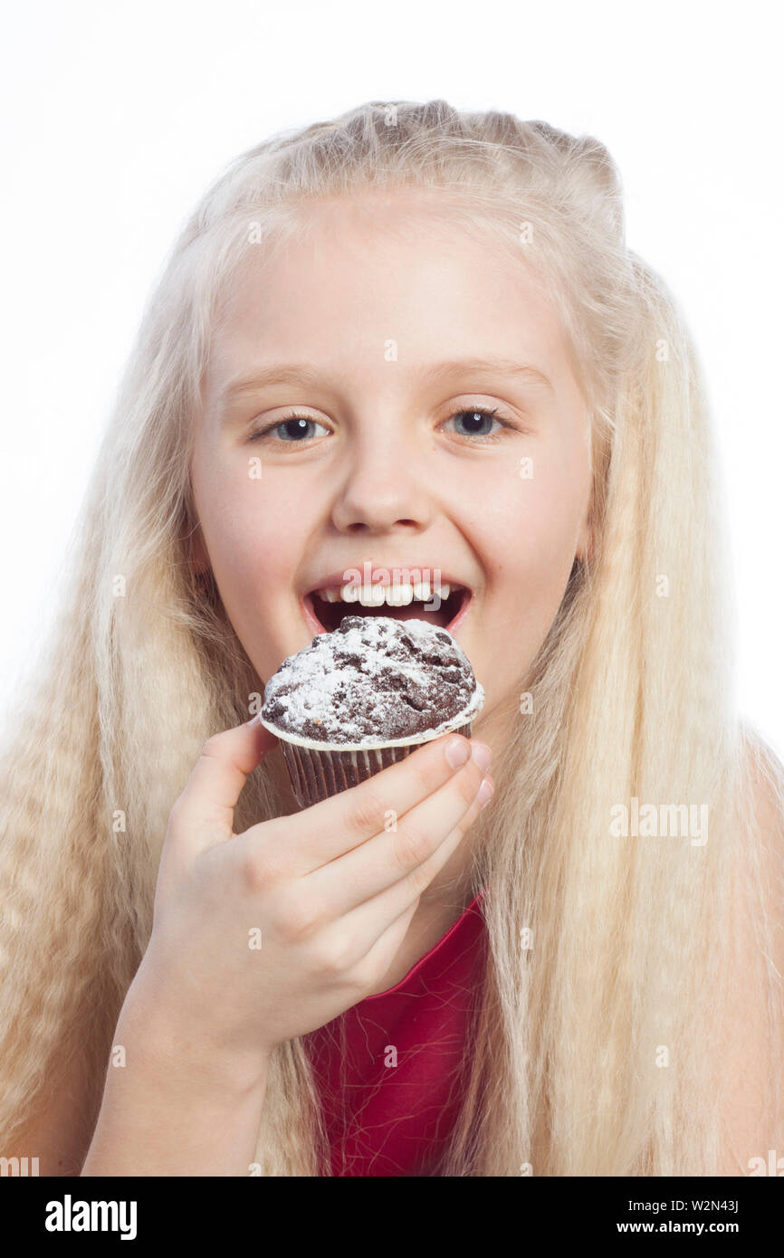 Girl biting a chocolate cake on white background Stock Photo - Alamy
