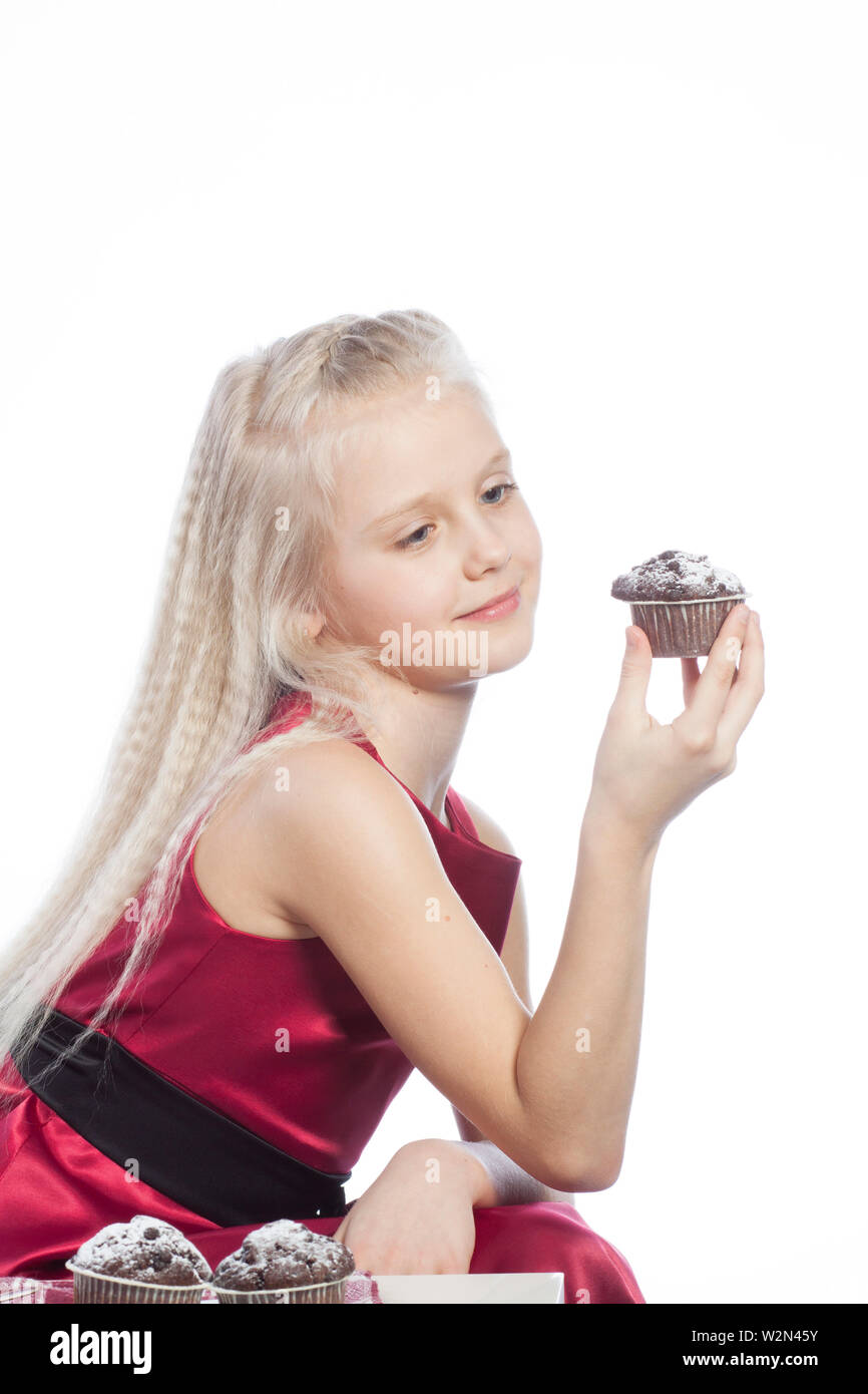 Girl biting a chocolate cake on white background Stock Photo - Alamy