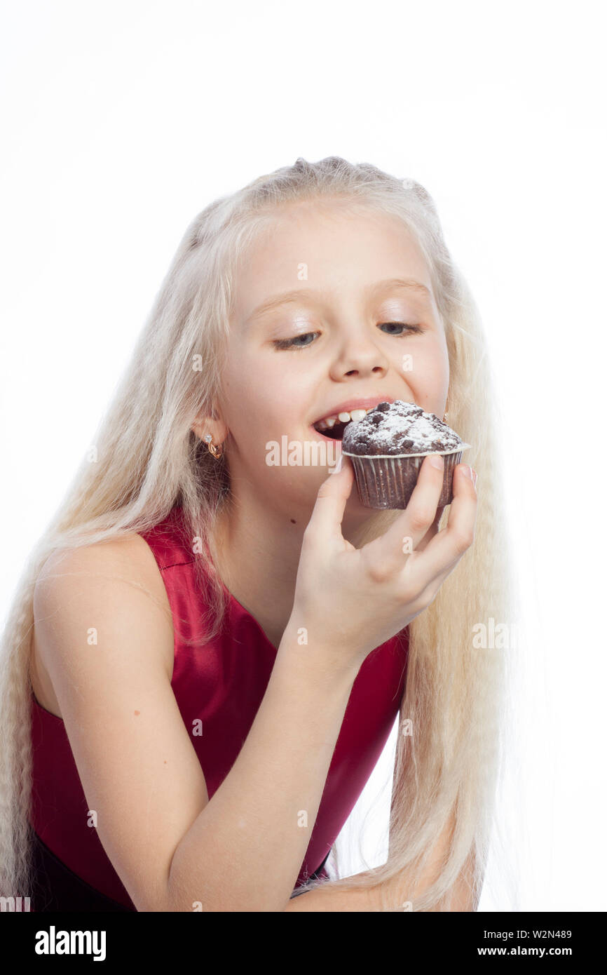 Girl biting a chocolate cake on white background Stock Photo - Alamy