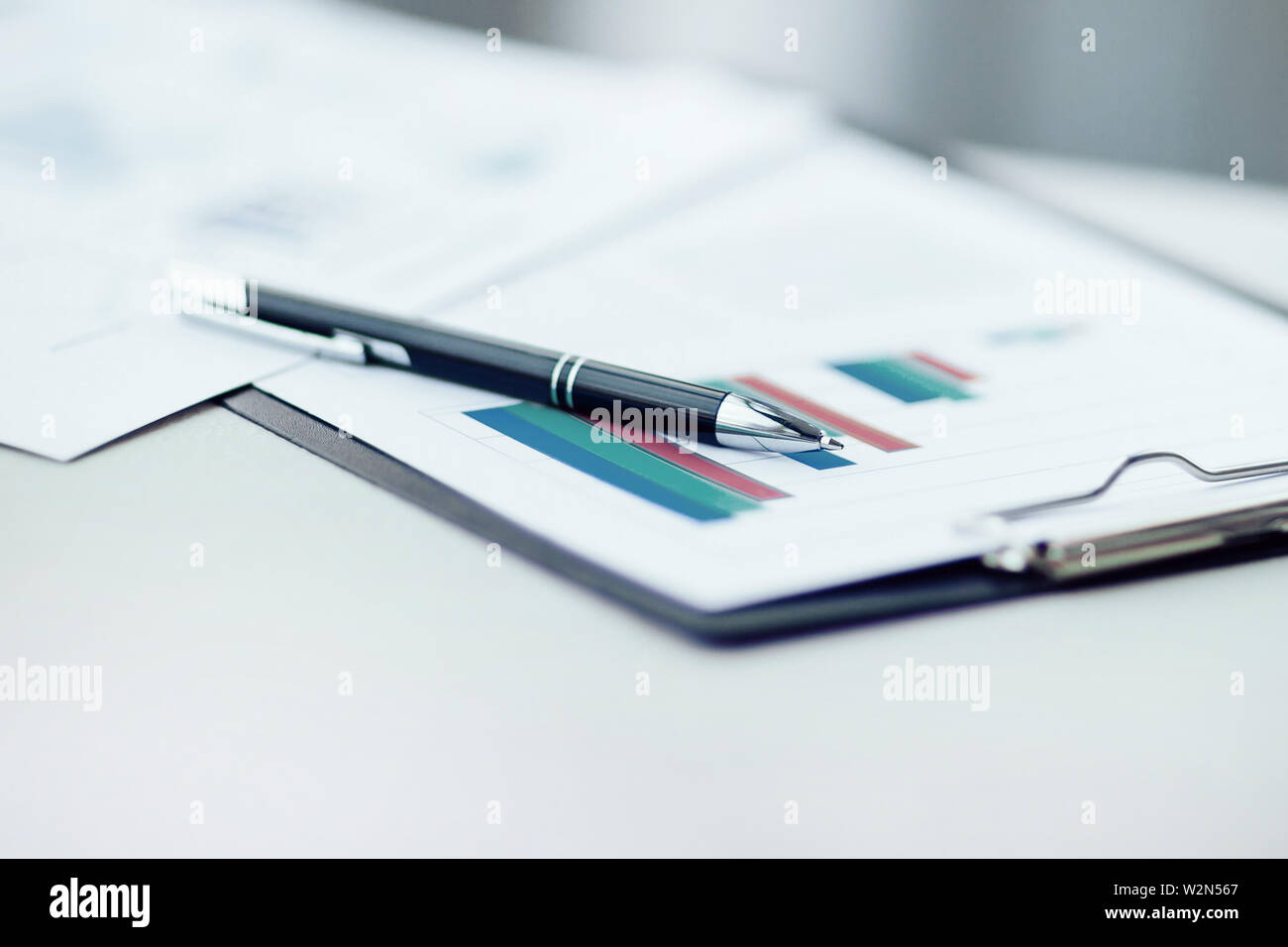 pen and financial report on office Desk background . business concept ...