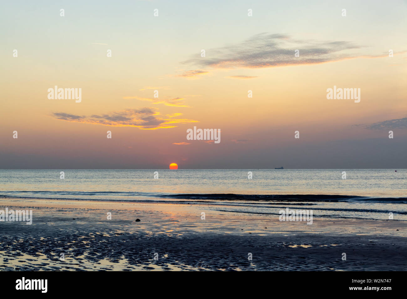 Sun rising over the sea seen from the beach of Isle of Wight Stock ...
