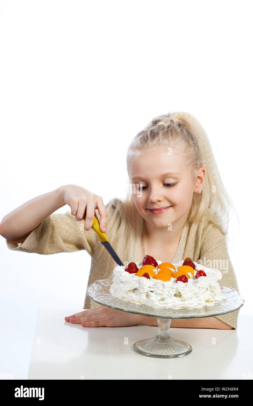 Girl eats a cake on white background Stock Photo - Alamy