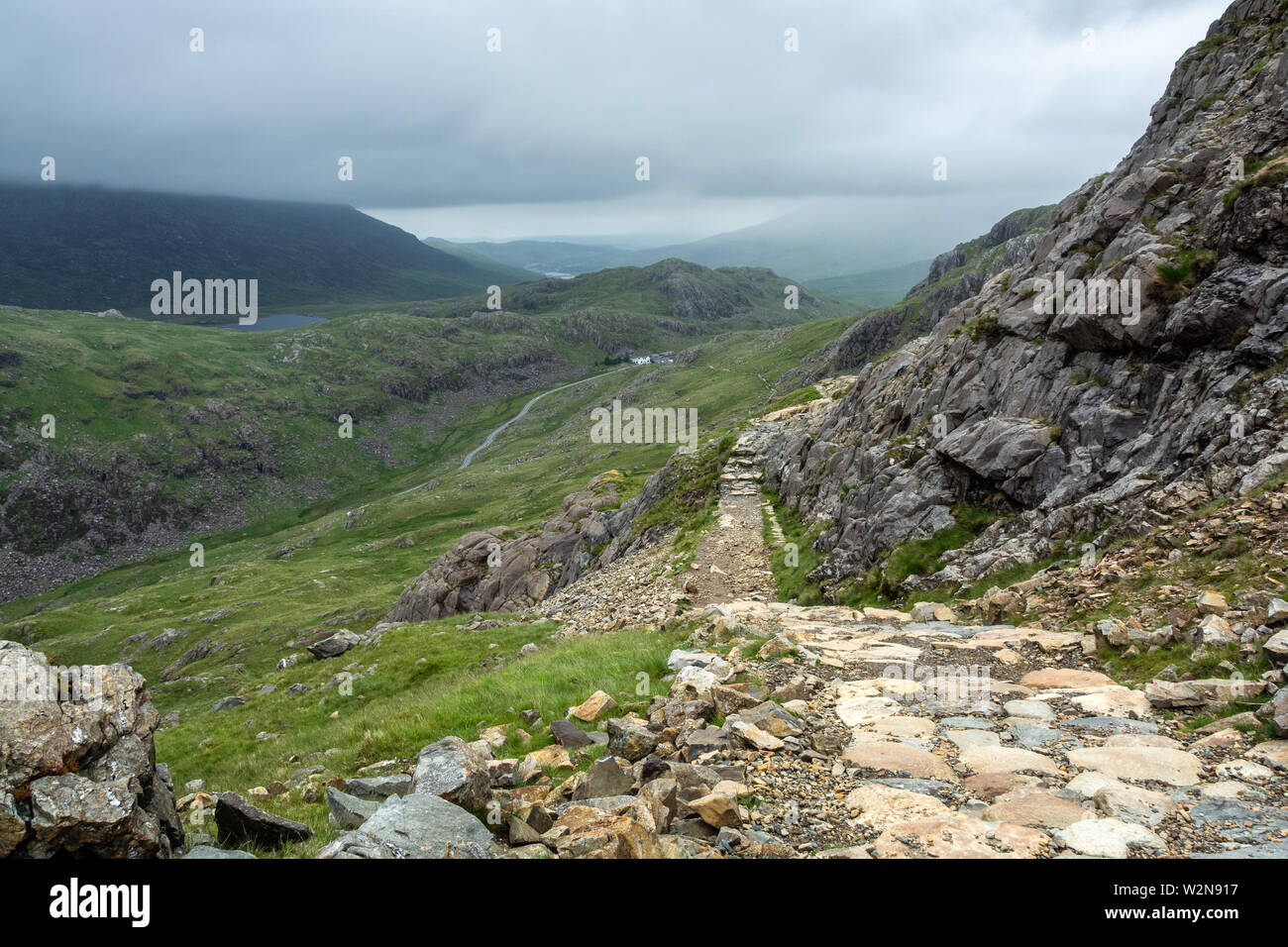 Hiking down from Snowdon mountain along the PYG track on overcast day ...