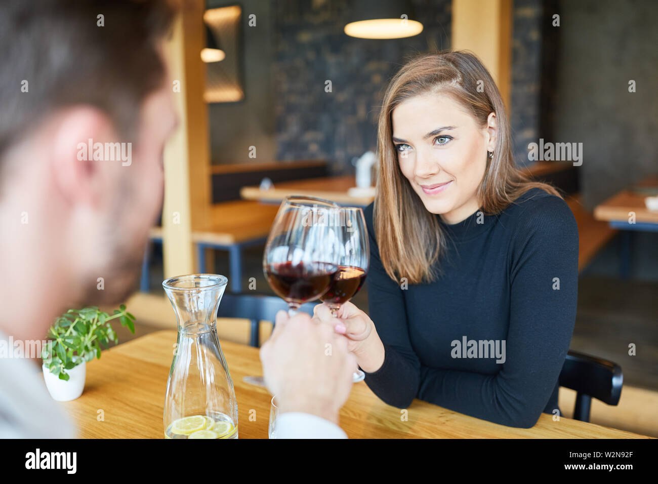 Romantic couple toasting glass hi-res stock photography and images - Alamy