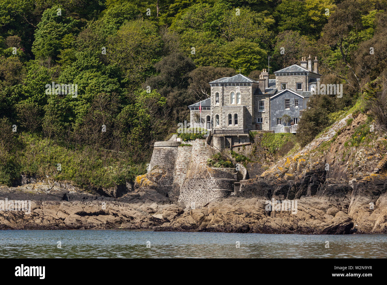 Old house in Fowey harbour (summer image Stock Photo - Alamy