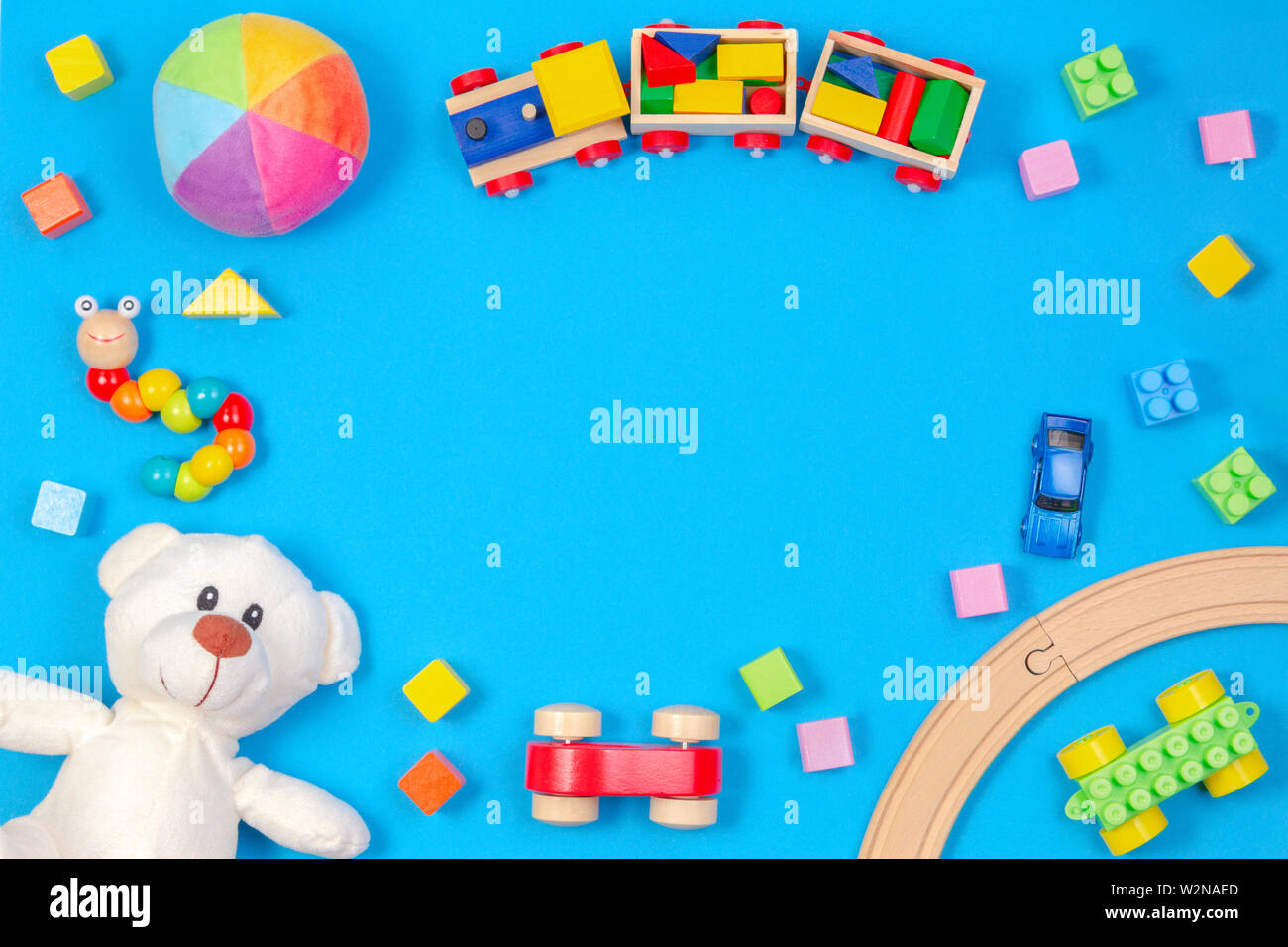 Colorful kids toys frame on blue background. Top view. Flat lay Stock ...