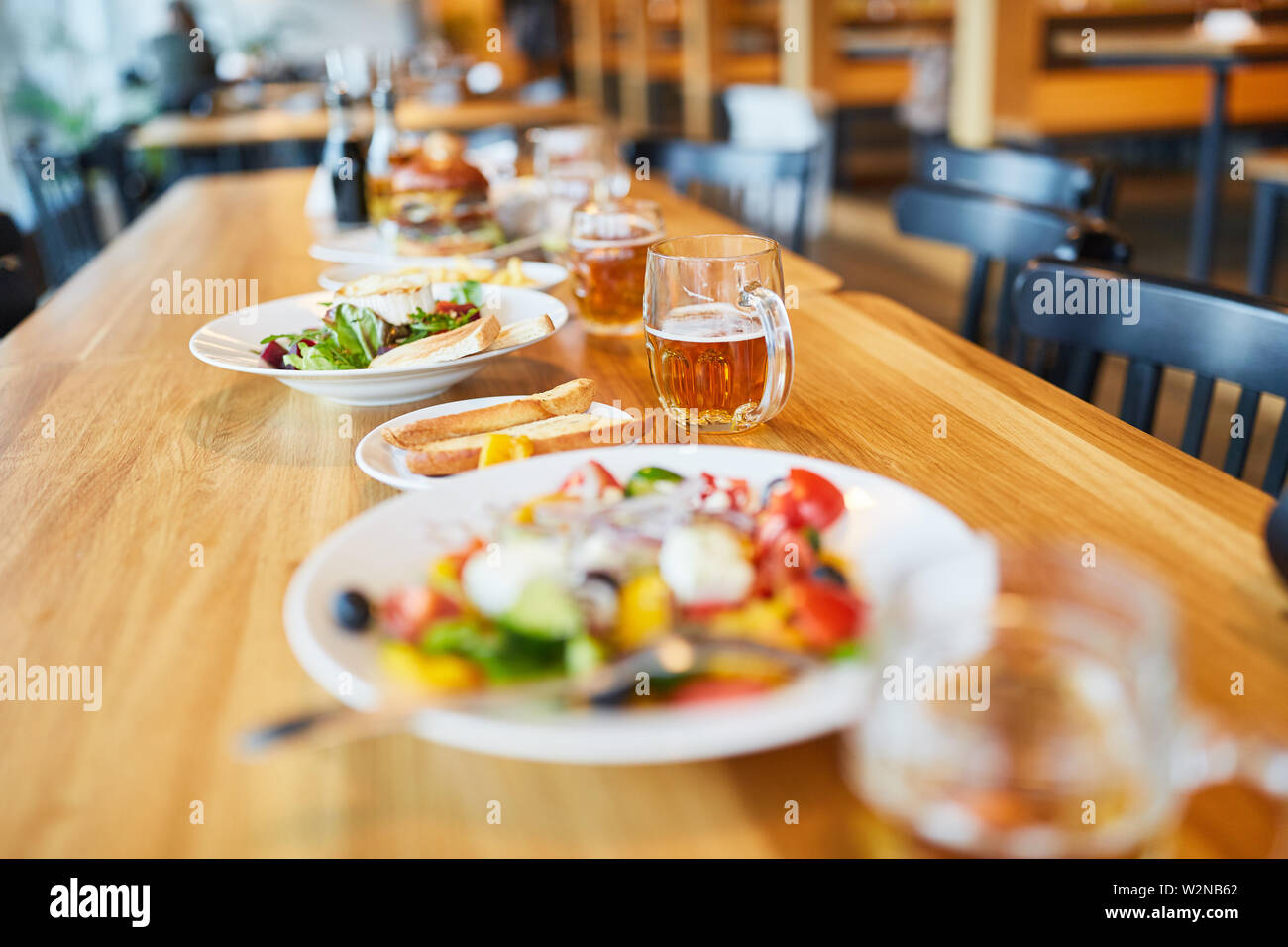 Various dishes on a table in a restaurant or bistro Stock Photo - Alamy
