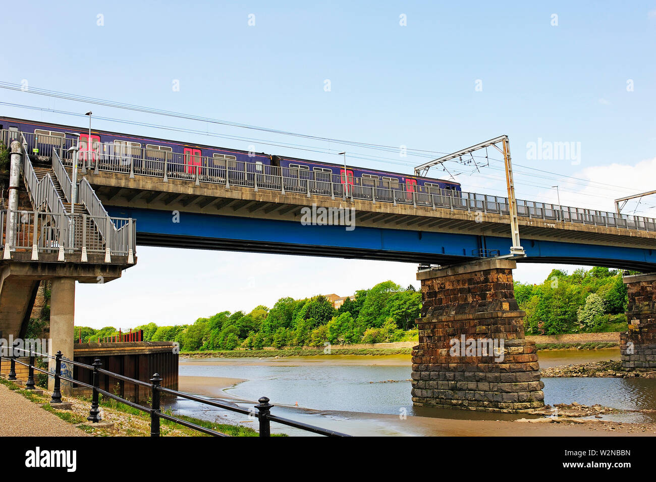 Joint railway and footbridge over the River Lune at Lancaster,UK Stock ...