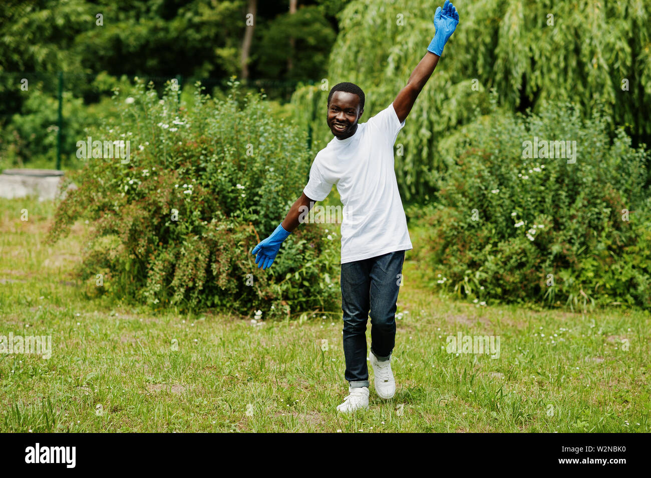 African volunteer man in park. Africa volunteering, charity, people and ...