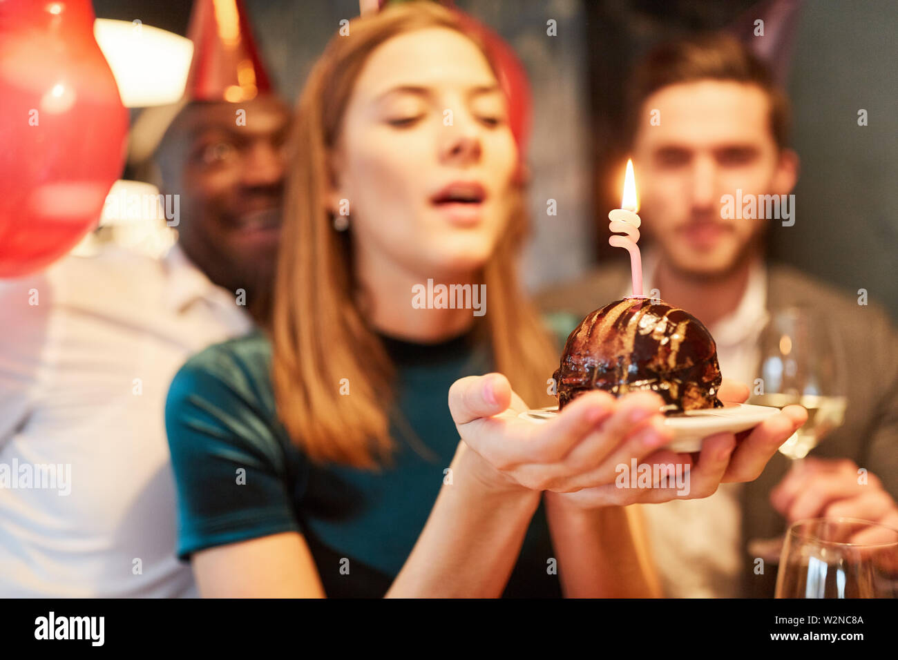 Blowing out birthday cake hi-res stock photography and images - Alamy