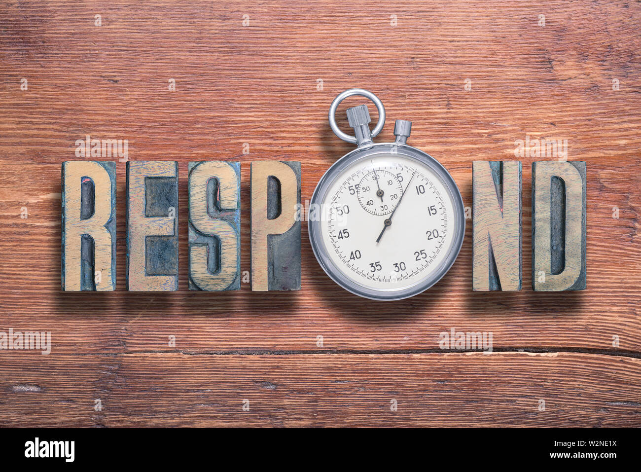 respond word combined on vintage varnished wooden surface with ...