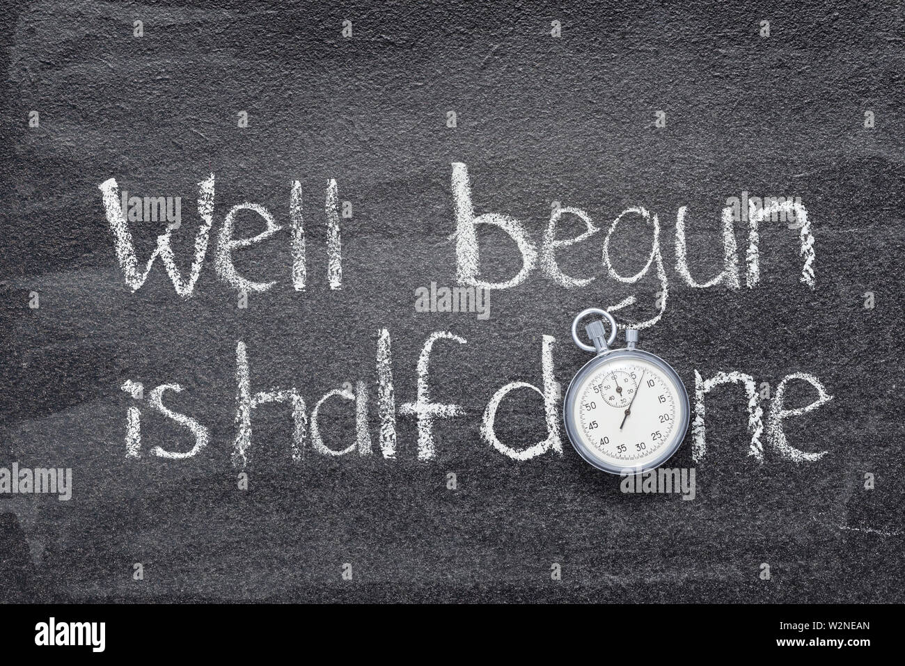 well begun is half done proverb written on chalkboard with vintage ...