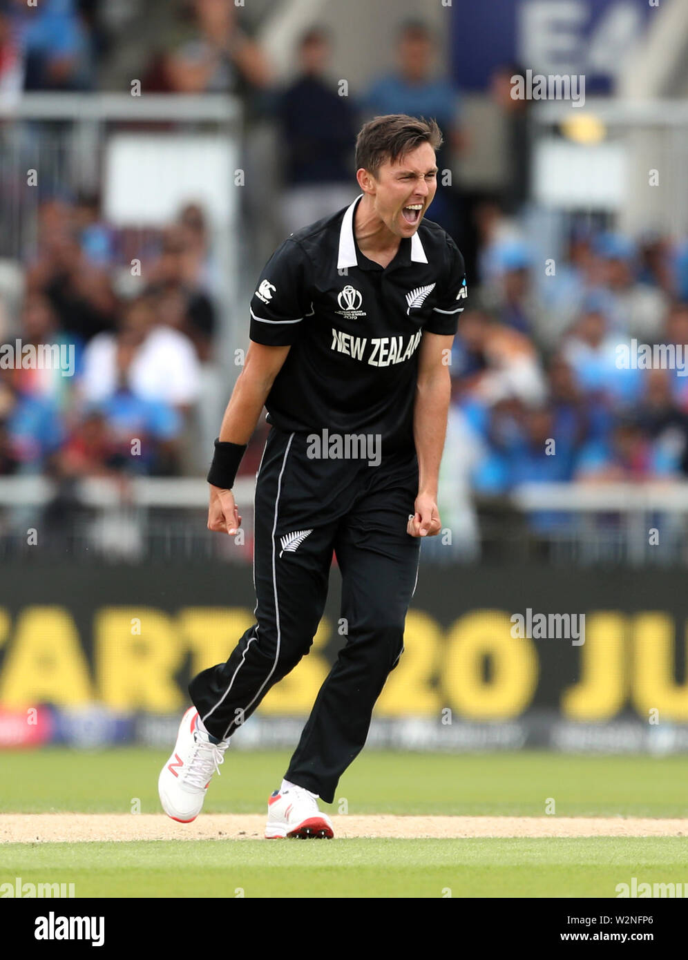 New Zealand's Trent Boult celebrates taking the wicket of India's Virat ...