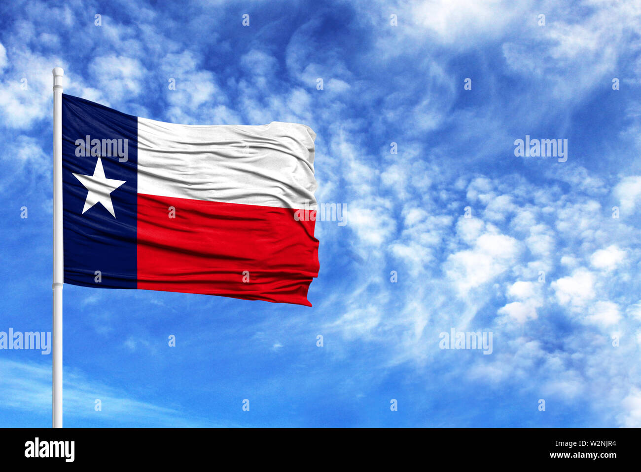 National flag State of Texas on a flagpole in front of blue sky Stock ...