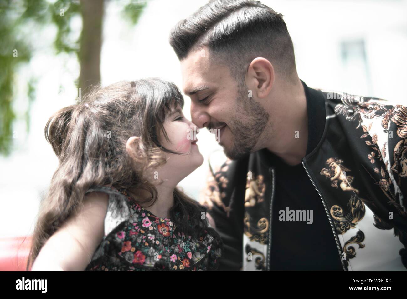loving father and daughter prodding noses Stock Photo - Alamy