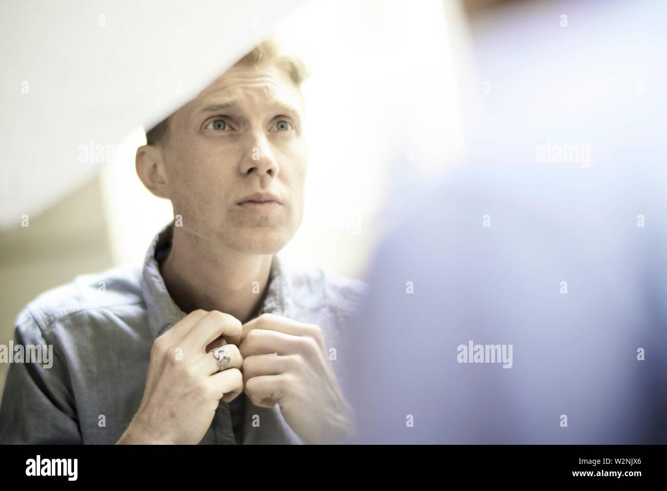 Man checking himself mirror hi-res stock photography and images - Alamy