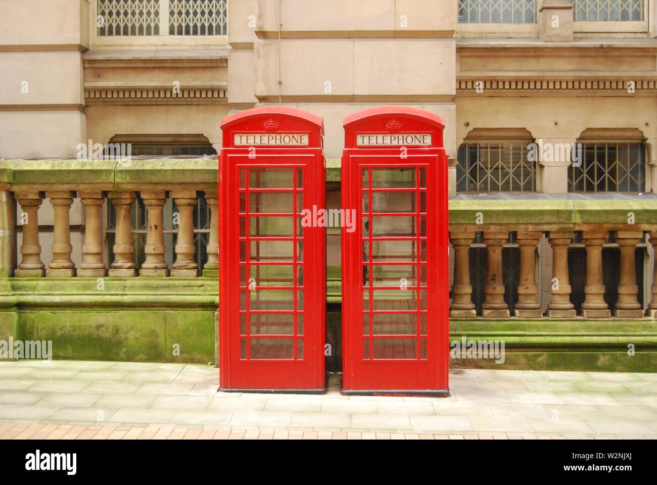 Two Red Telephone Kiosks Stock Photo - Alamy