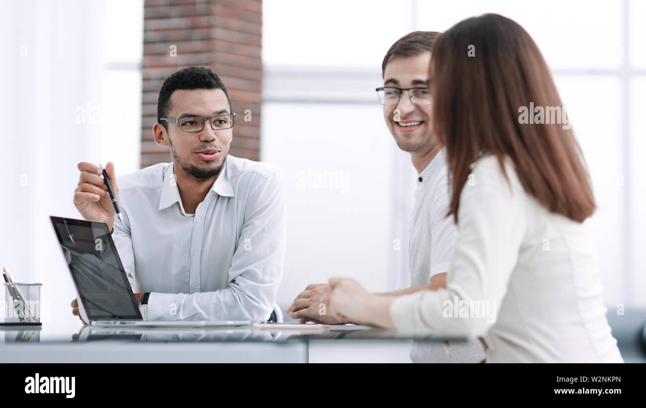 group of employees discussing new ideas at a working meeting . office ...