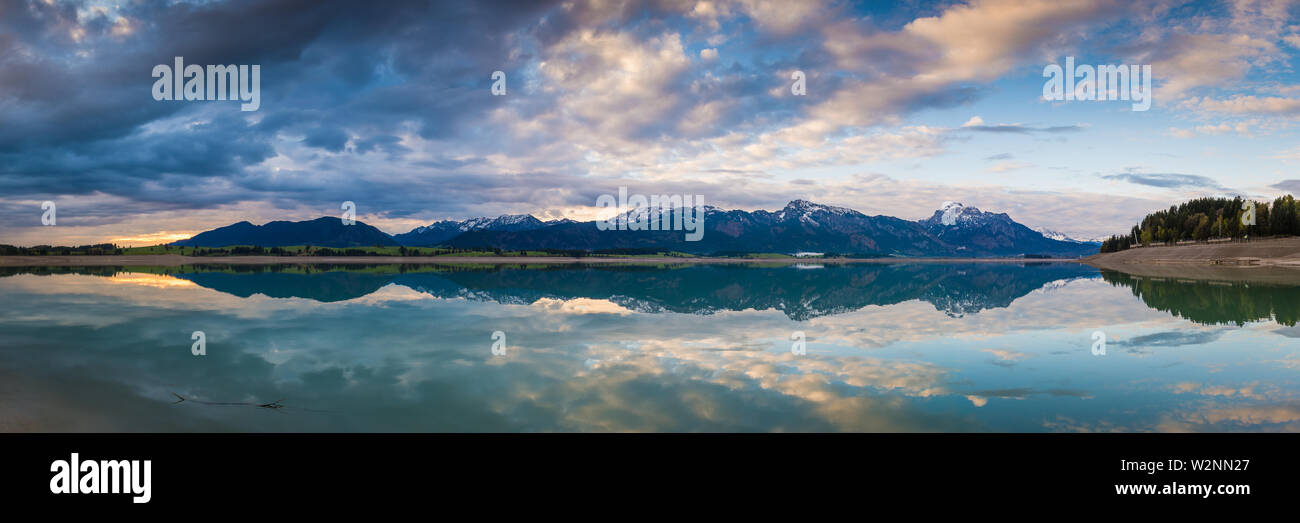 Lake Forggensee in the Alps of Bavaria at dawn - panorama Stock Photo ...