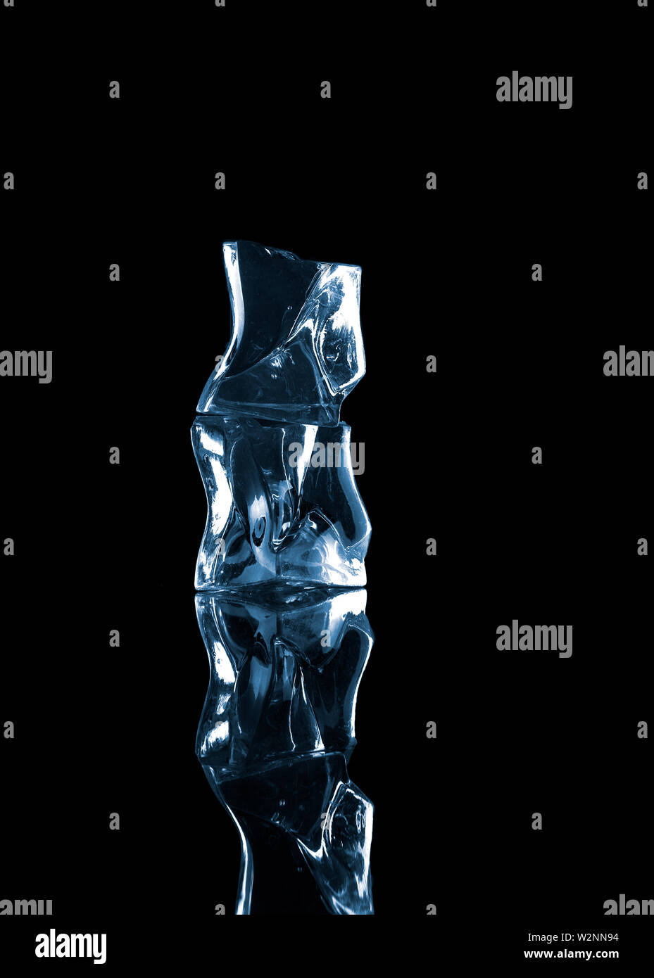 Two ice cubes with water mirror isolated on black background Stock ...