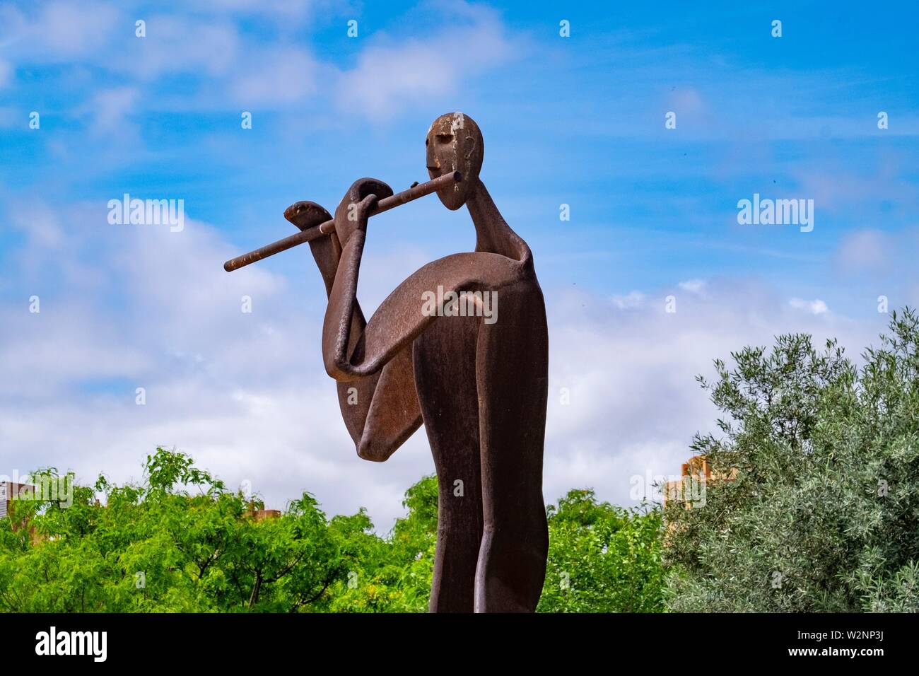 Statue flute player hi-res stock photography and images - Alamy