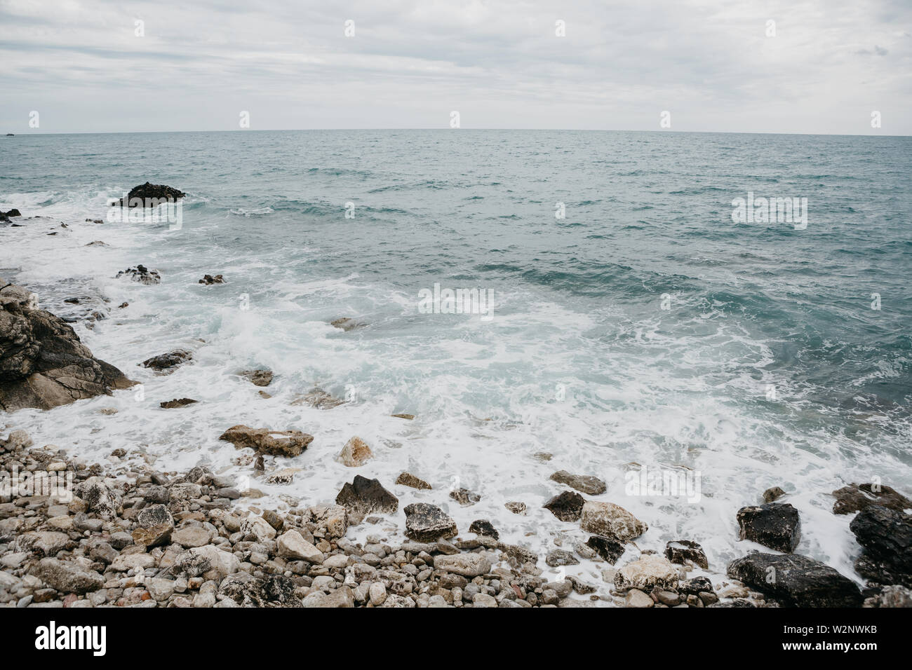 Restless sea near the stone coast. Surf. Natural landscape Stock Photo ...