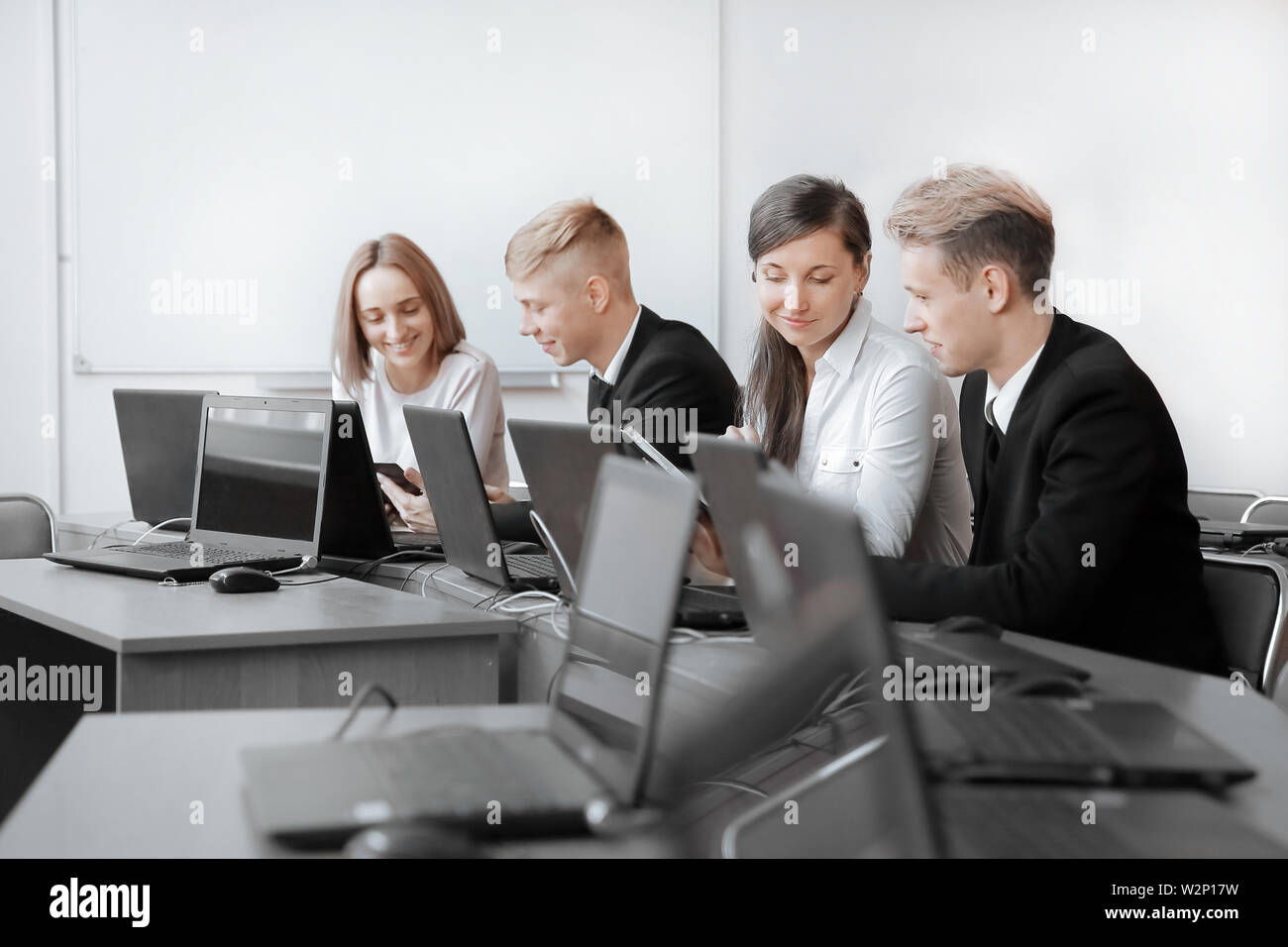 group of Programmers working in the office of the software developer ...