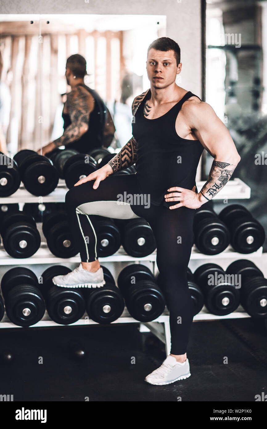 successful fitness trainer standing in the gym. photo with copy space ...