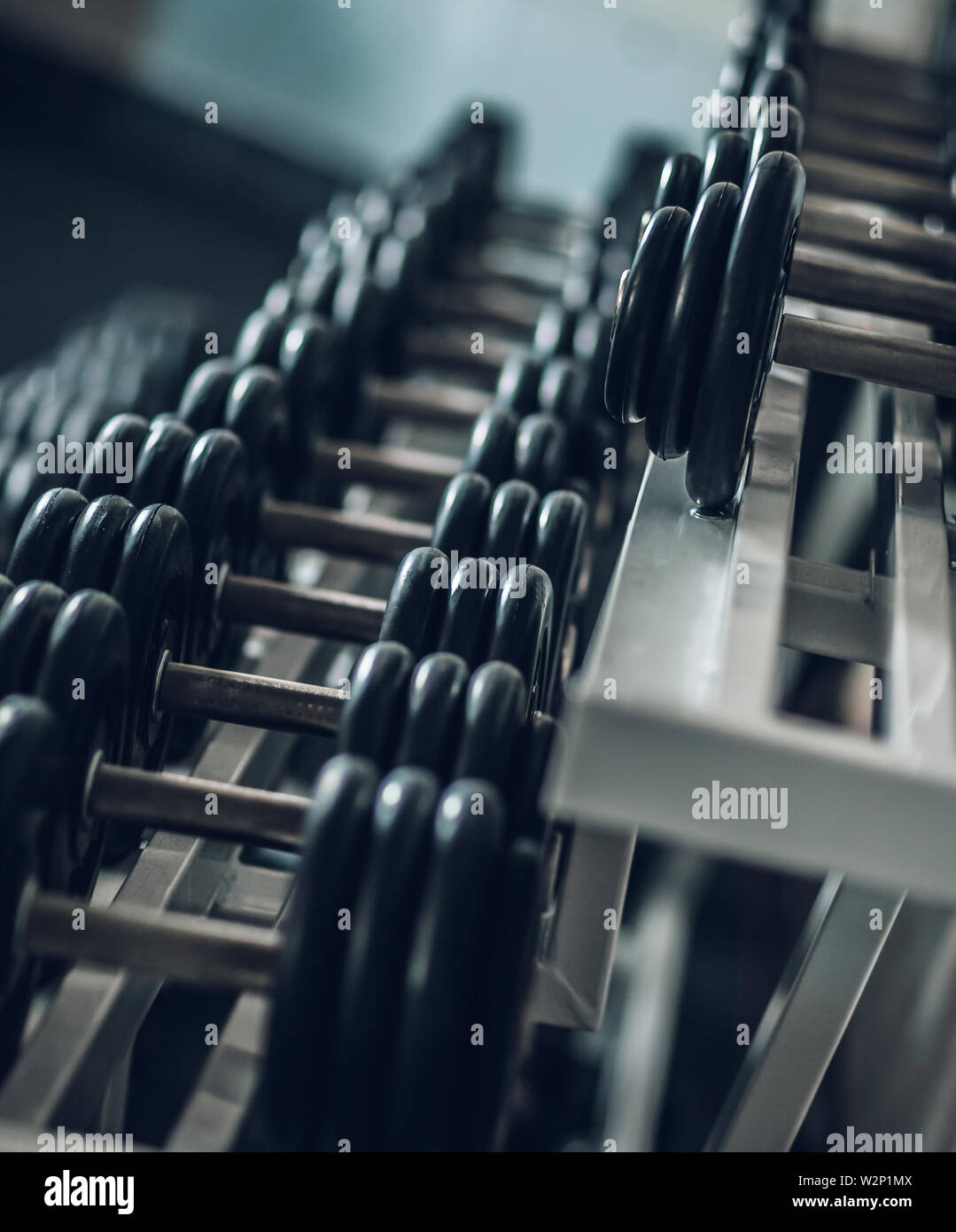 close up. Rows of dumbbells in the gym . sports background Stock Photo ...
