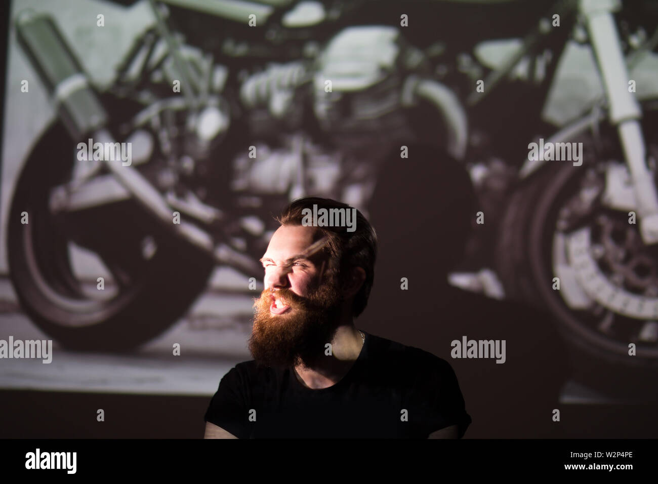 Man black hair on a motorcycle hi-res stock photography and images - Alamy