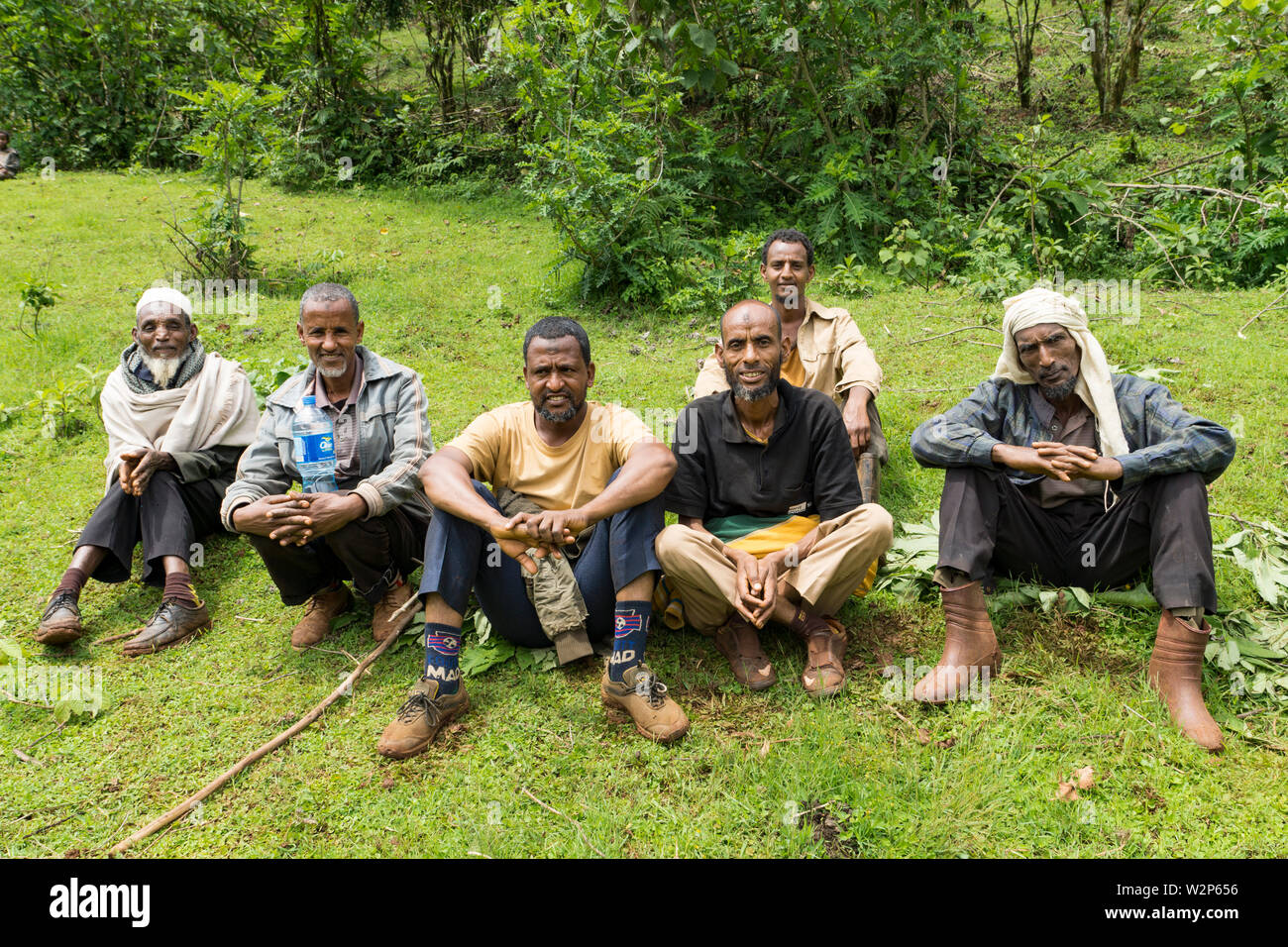 Group of Muslim farmers sitting in a field in Illubabor, Ethiopia Stock ...
