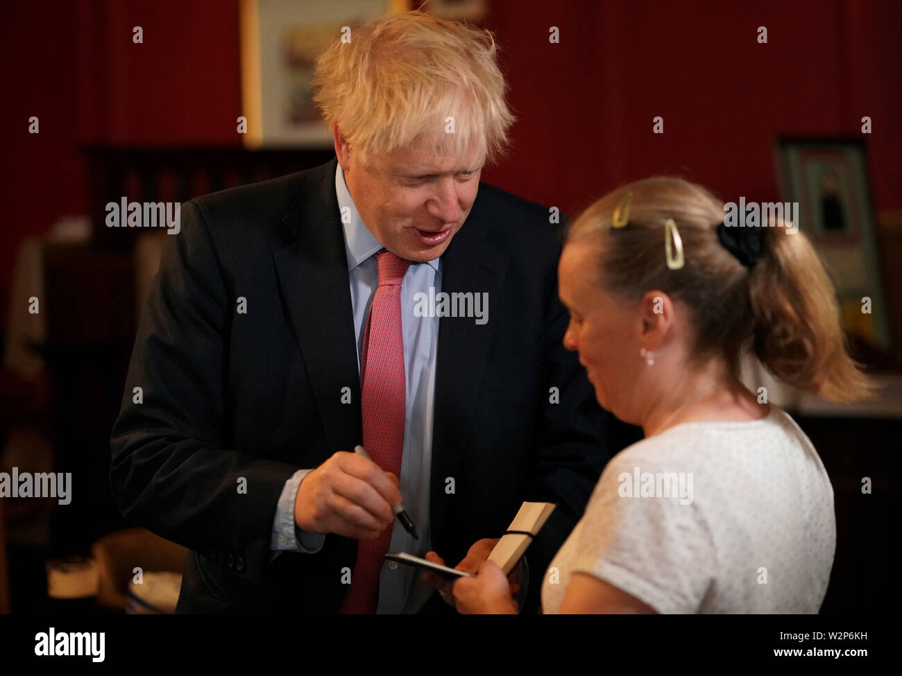 Conservative Party leadership candidate Boris Johnson signs an ...