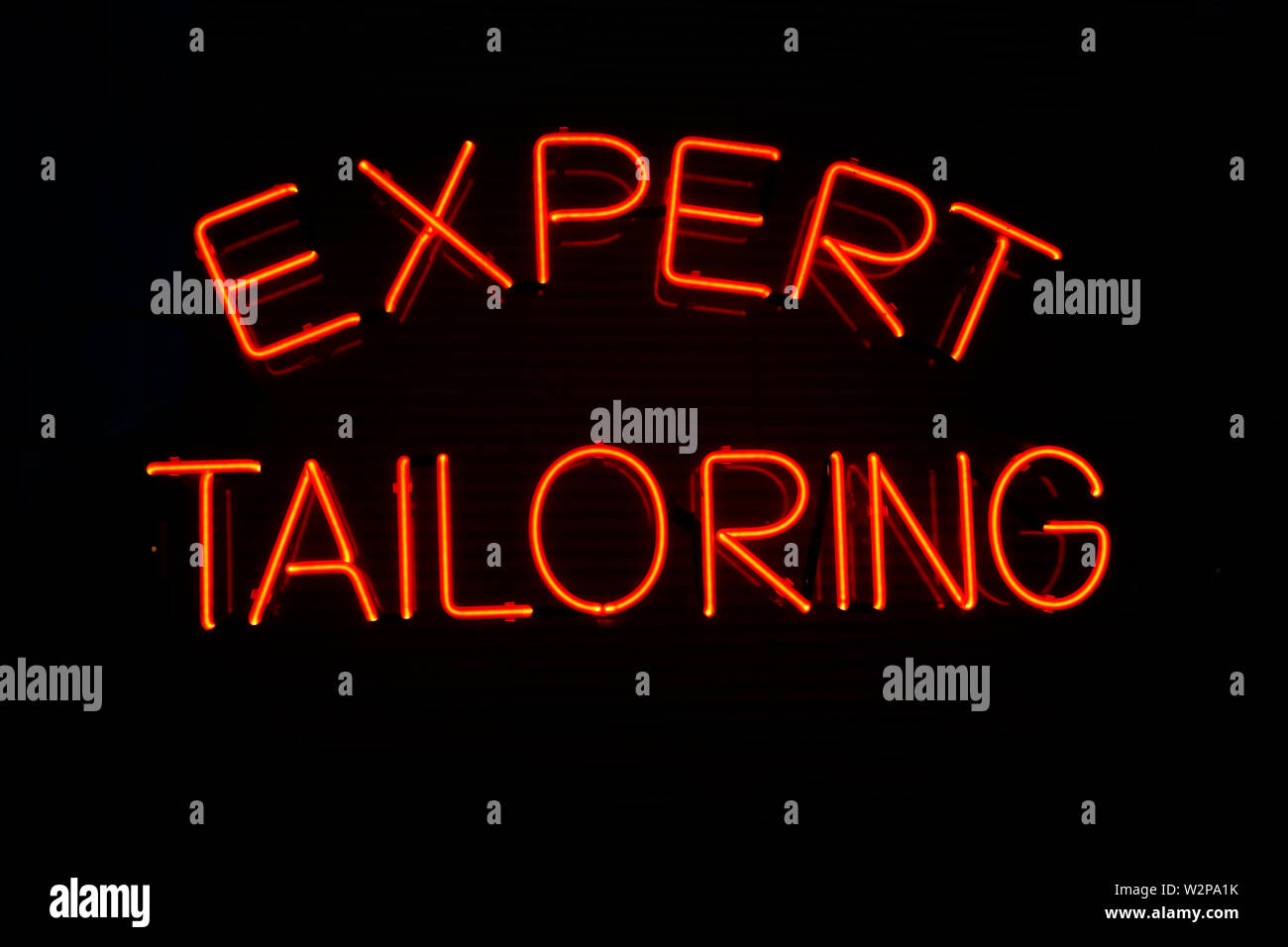 Expert Tailoring neon business sign Stock Photo - Alamy