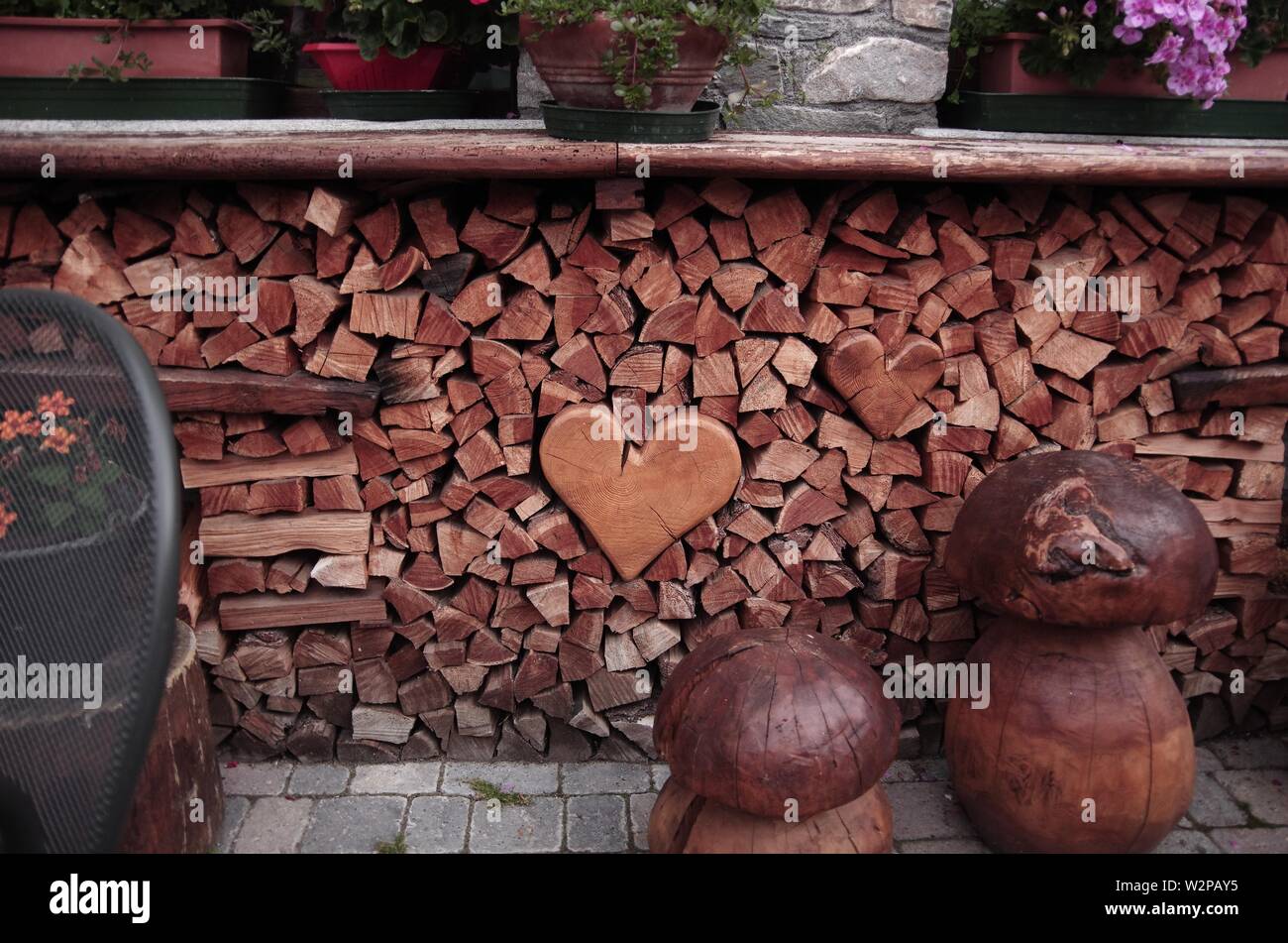 Stack of wooden planks with a heart-shaped cut wood in the middle Stock ...