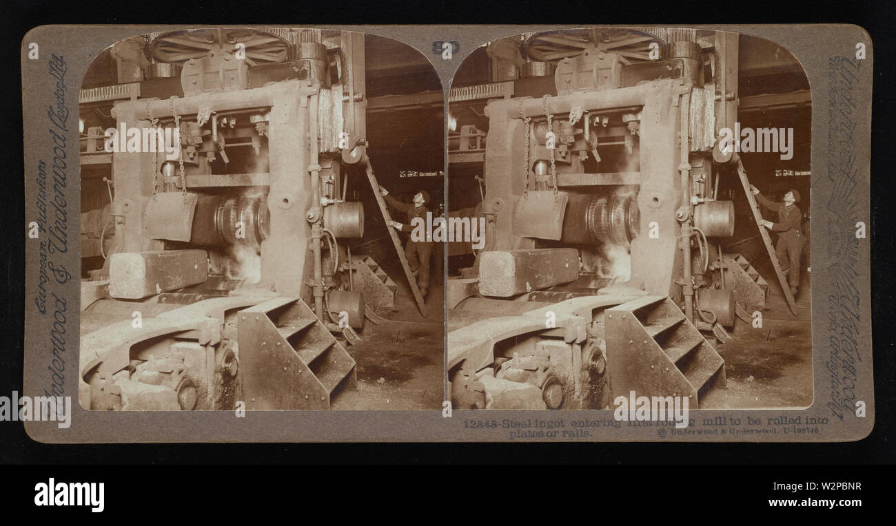 Steel ingot entering first rolling mill to be rolled into plates or ...