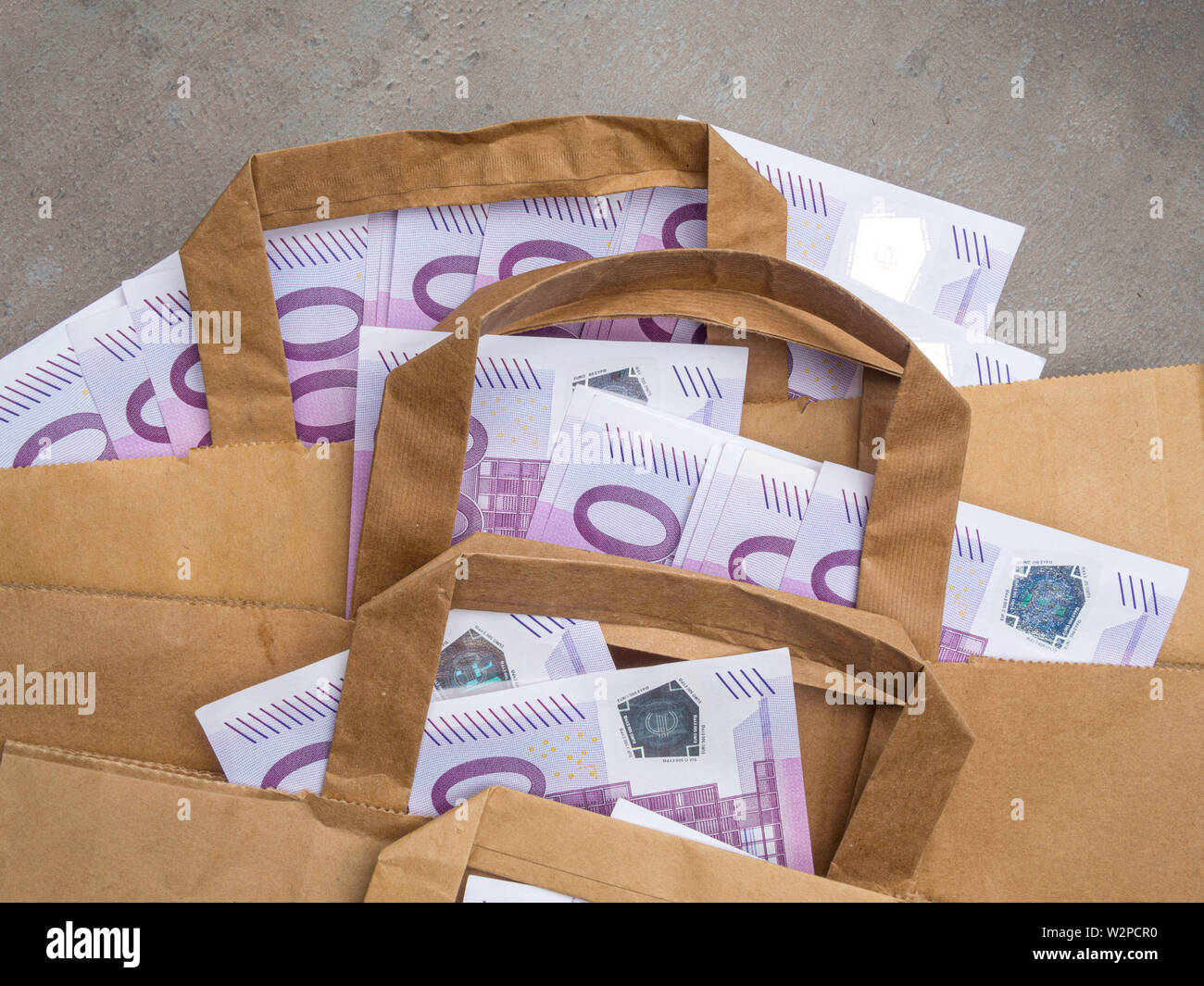 Paper bags with money 500 euro cash, corruption, bribe concept. close ...