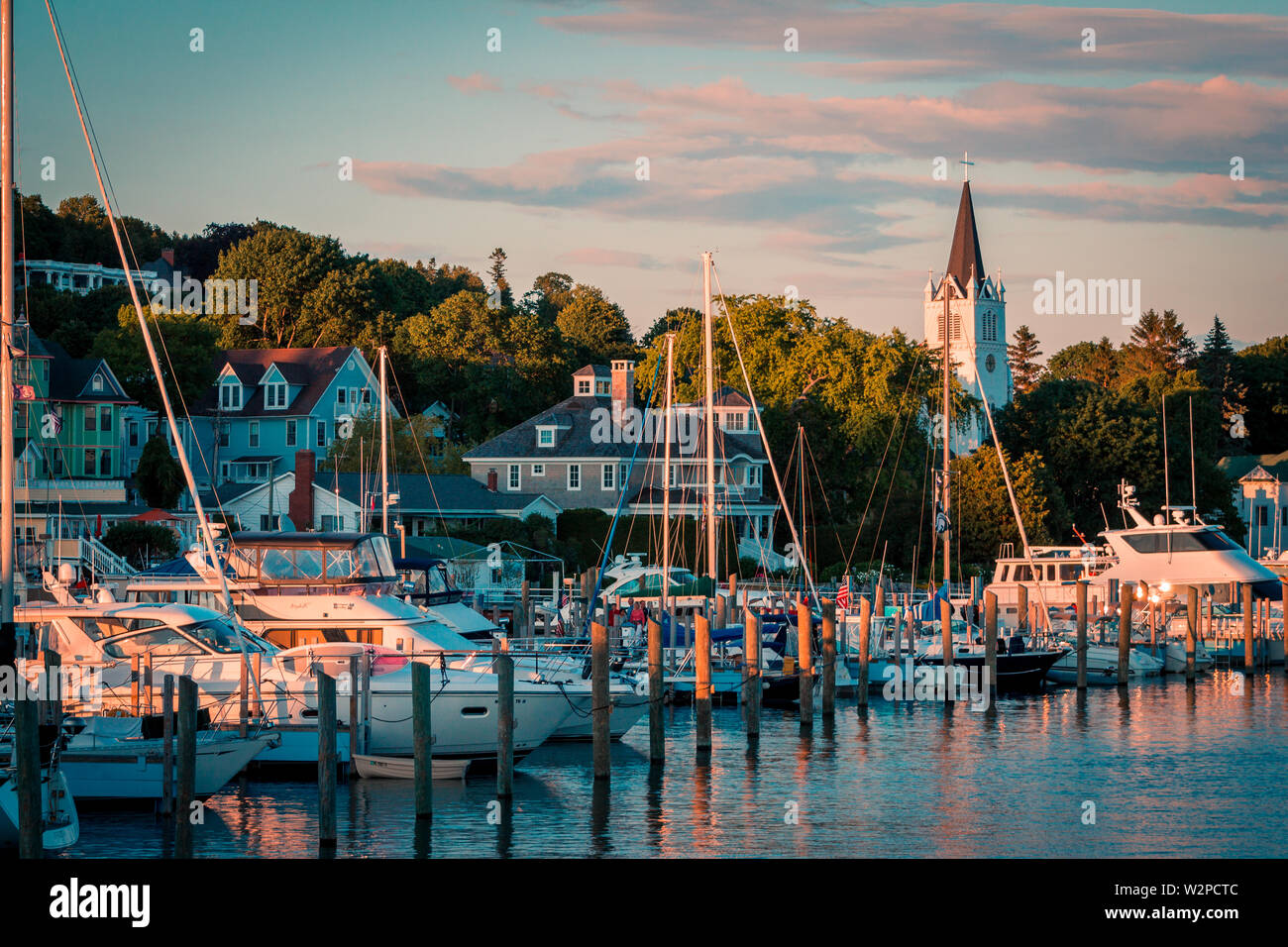 The Marina at Mackinac Island with Saint Anne's church and the historic ...