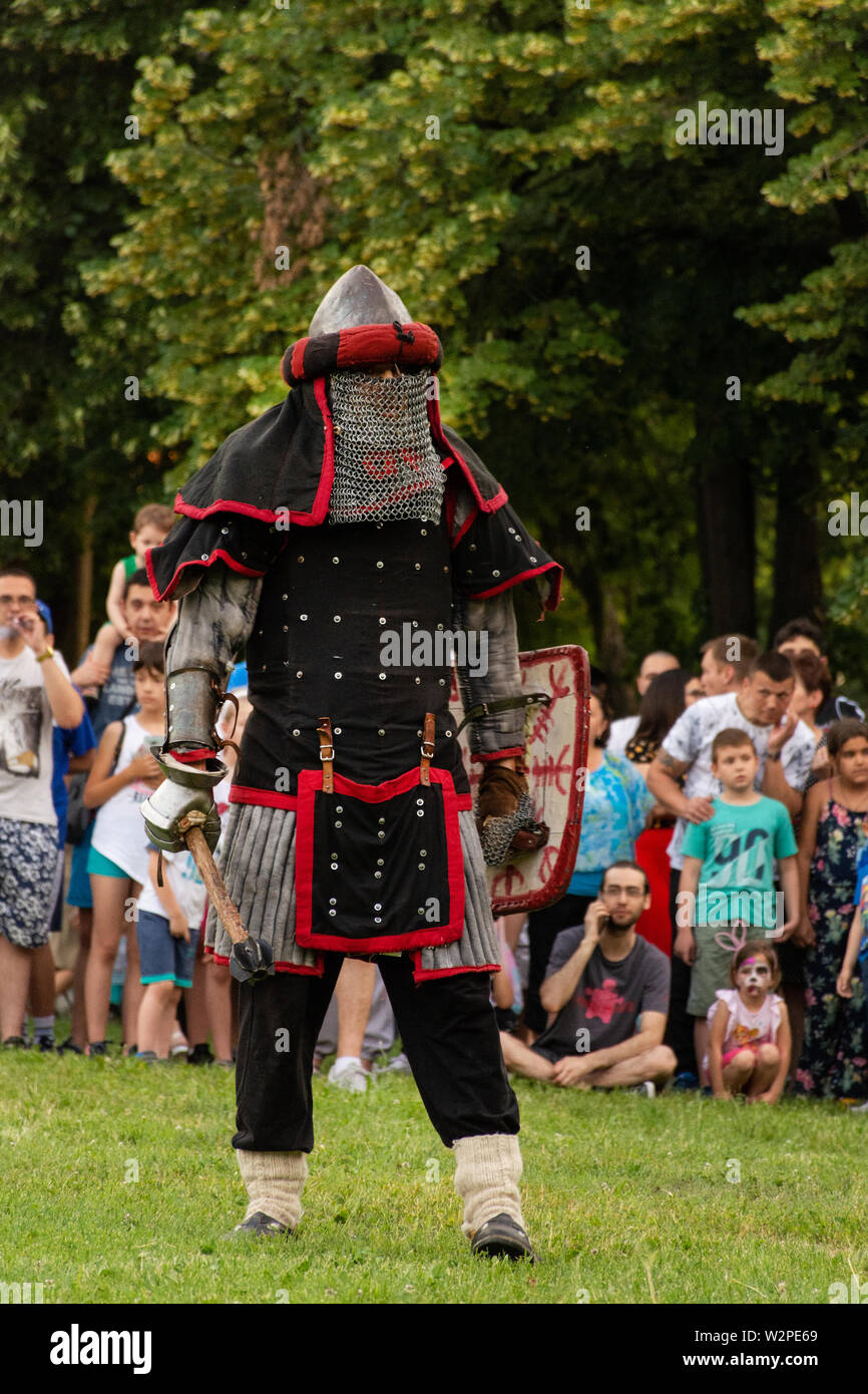 Nis, Serbia - June 15. 2019 Knight in armor and with mace and shield in ...