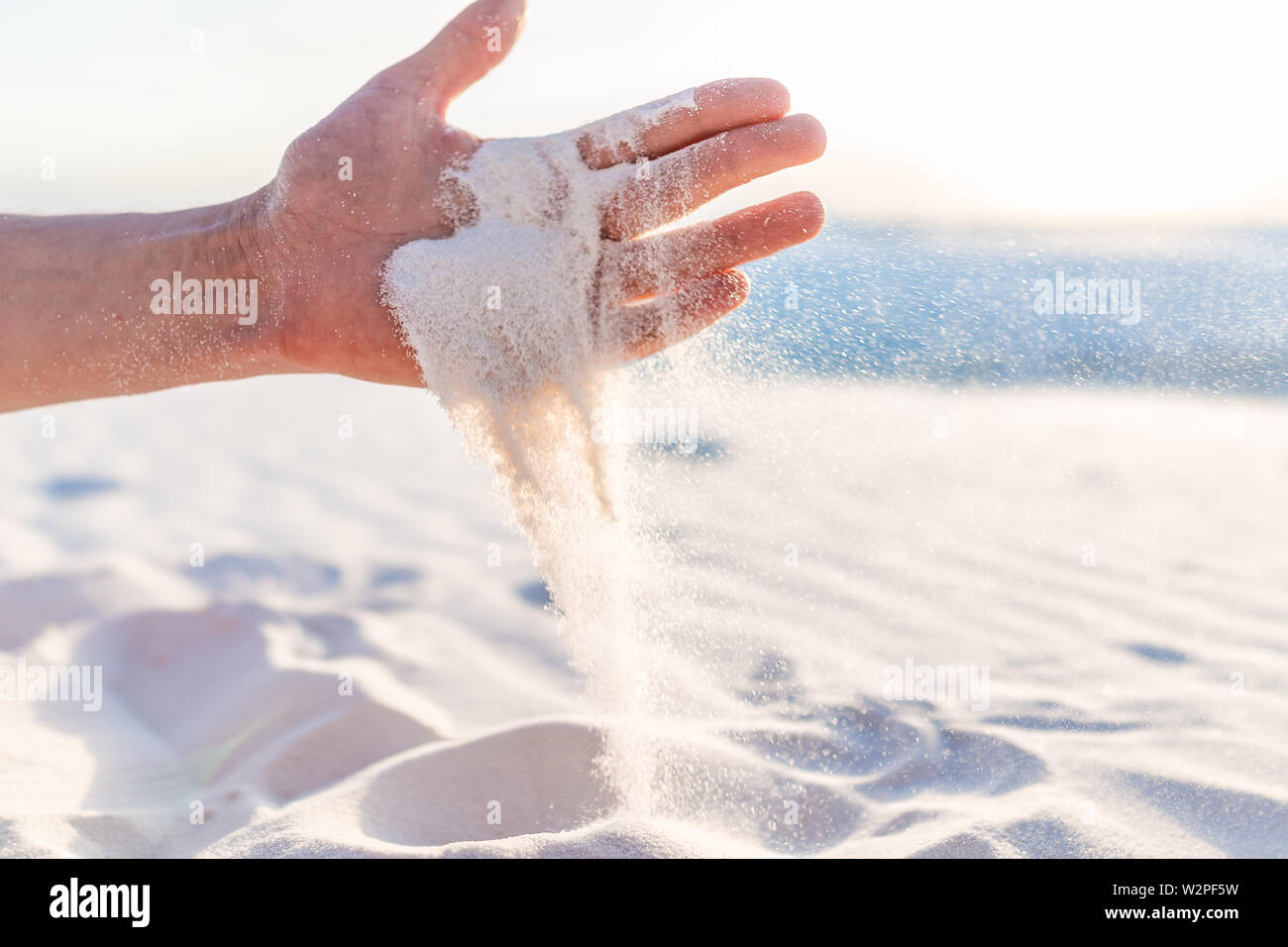 White sands dunes national monument man hand holding sand falling ...