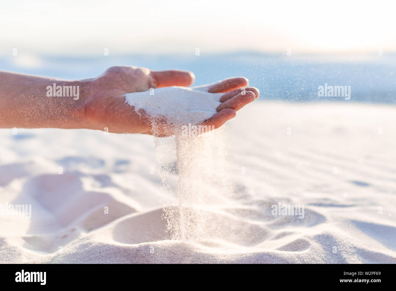 White sands dunes national monument hand holding sand falling grains in ...